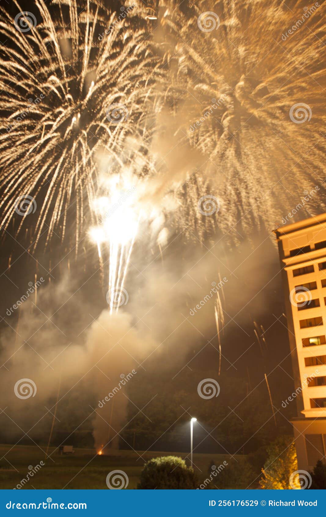View of Fireworks Next To a Tall Building Stock Image - Image of ...