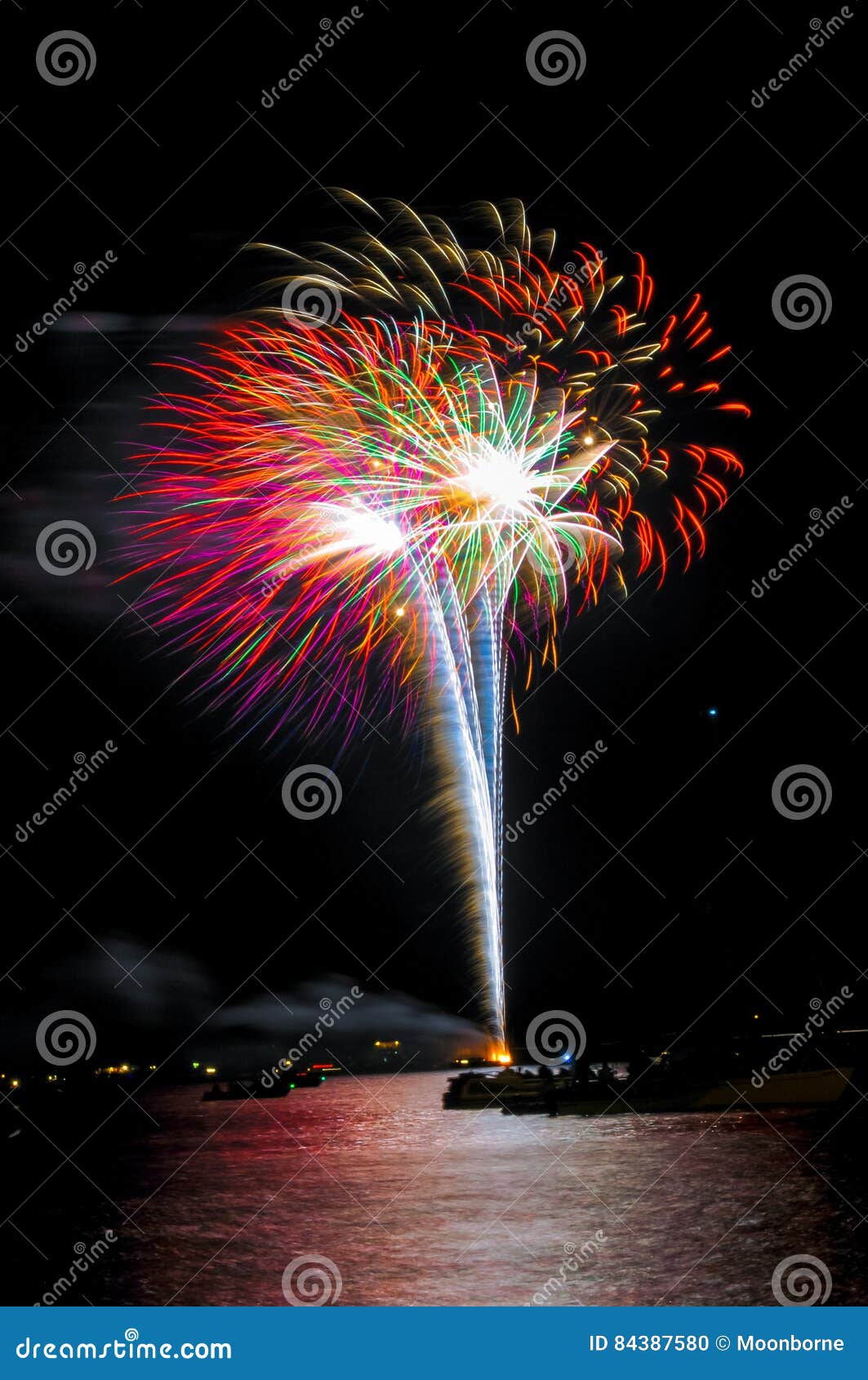 Fireworks over the water stock photo. Image of colored - 84387580