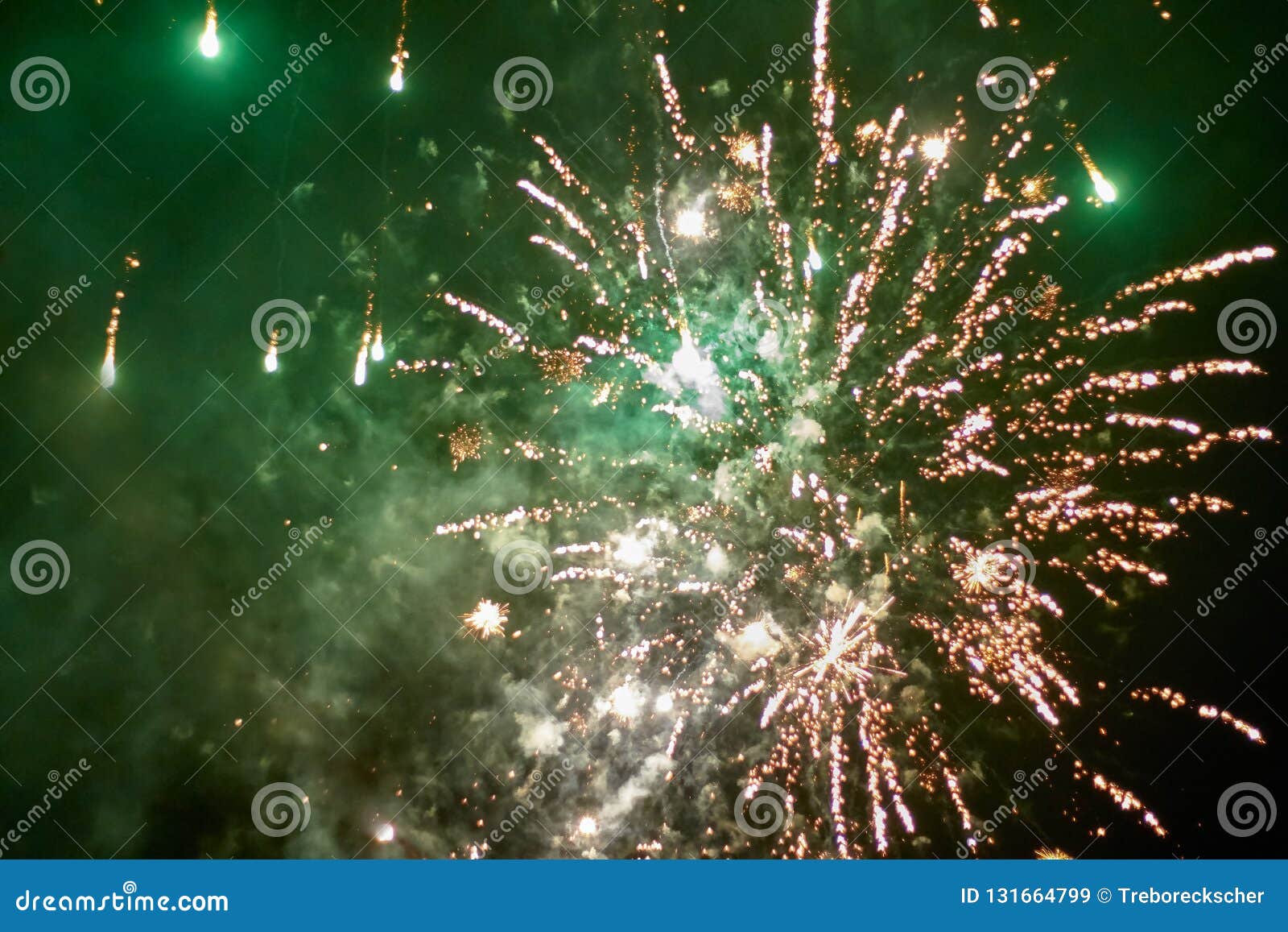 Fireworks Rockets Explode in the Green Illuminated Night Sky Stock ...