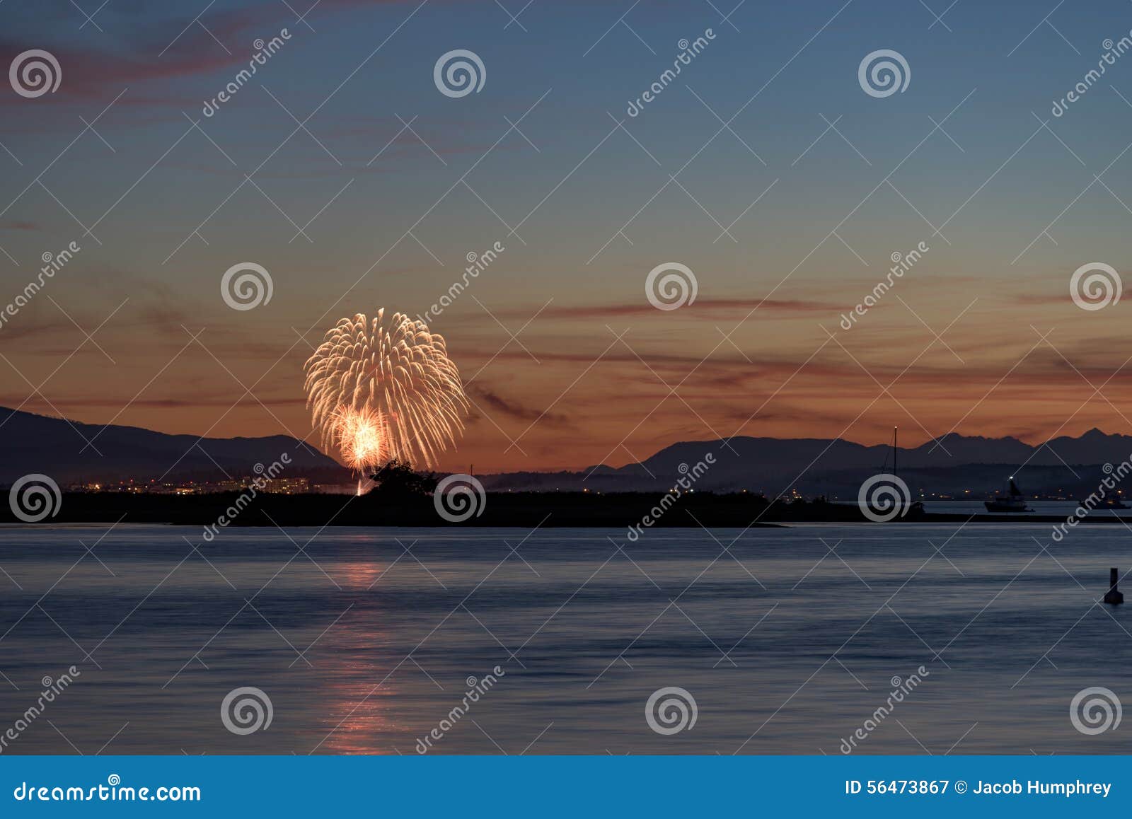 Fireworks in the sunset stock image. Image of city, ocean - 56473867