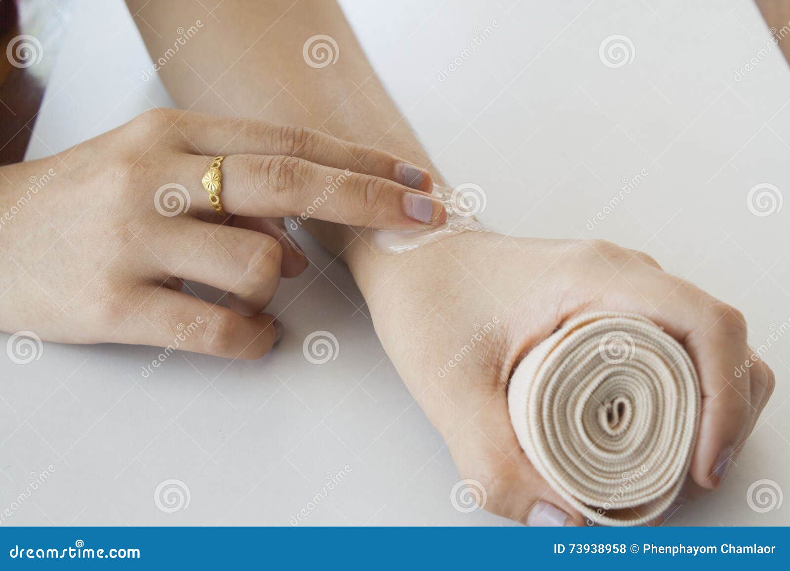First Aid Accident Wrist with Liniment Stock Photo - Image of paramedic ...