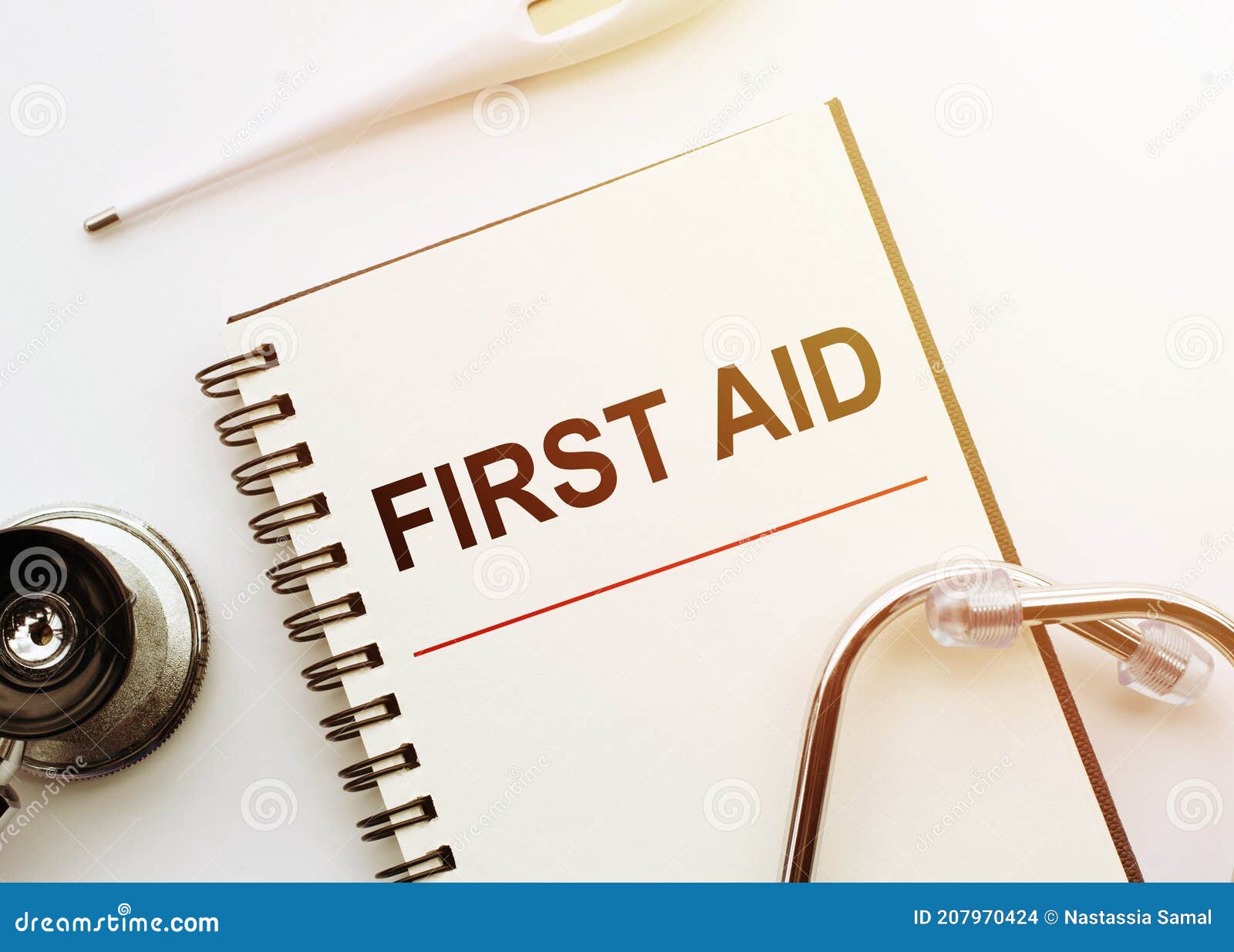FIRST AID Concept with Text on Medical Notebook with Stethoscope and ...