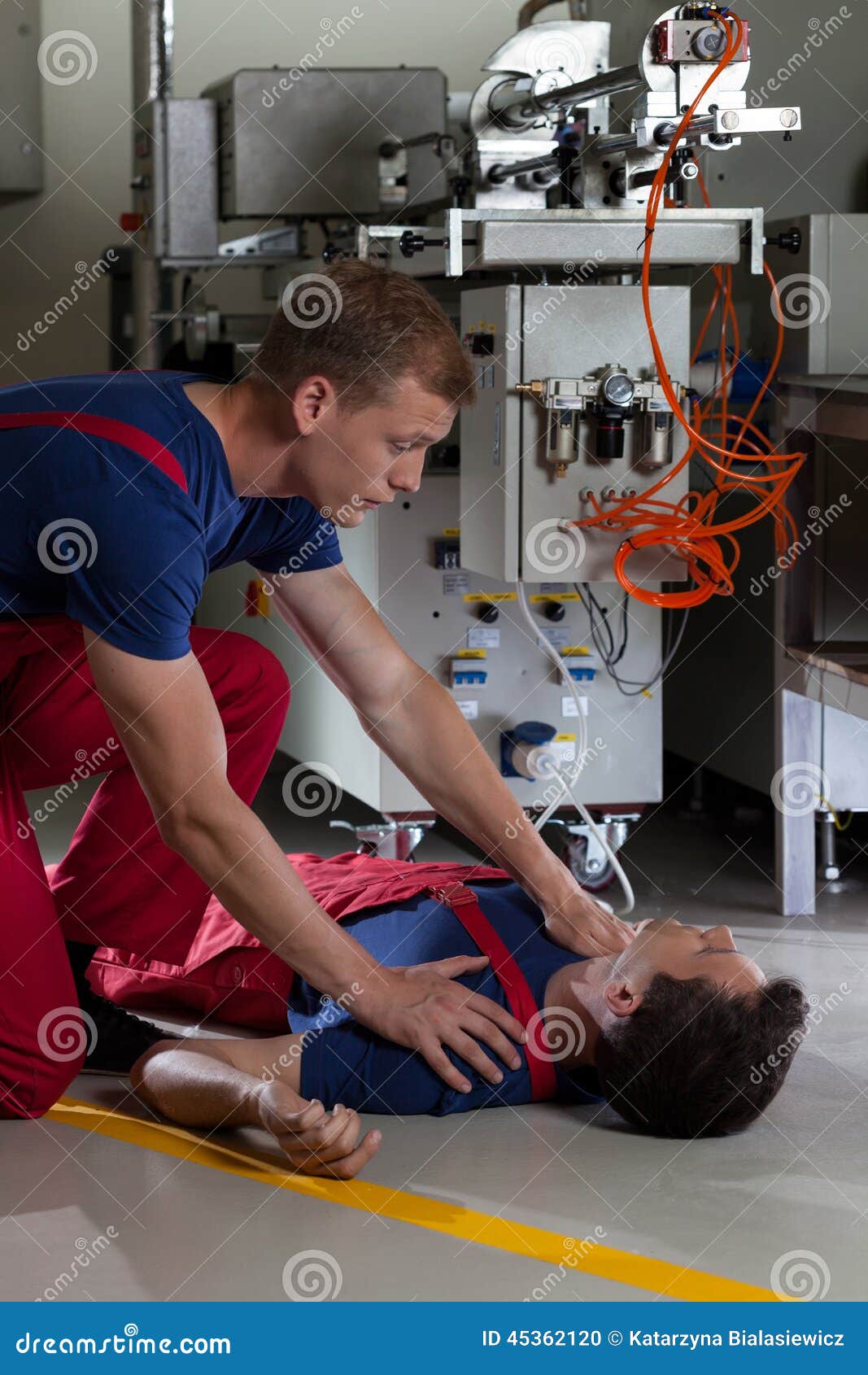 First aid in a factory stock photo. Image of laborer - 45362120