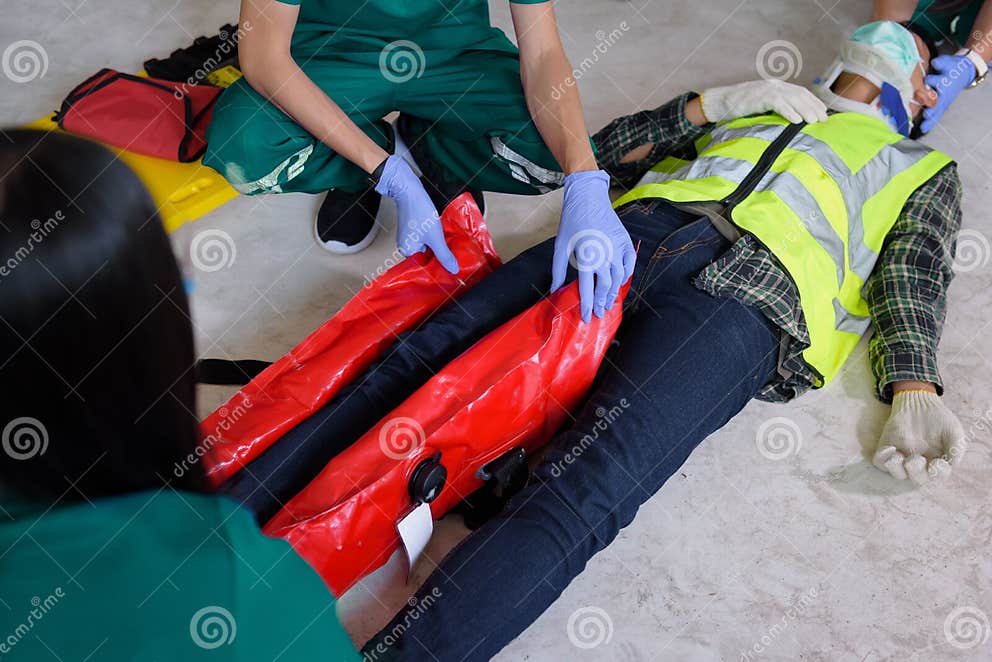 Accident in Industrial Work with First Aid Stock Image - Image of ...