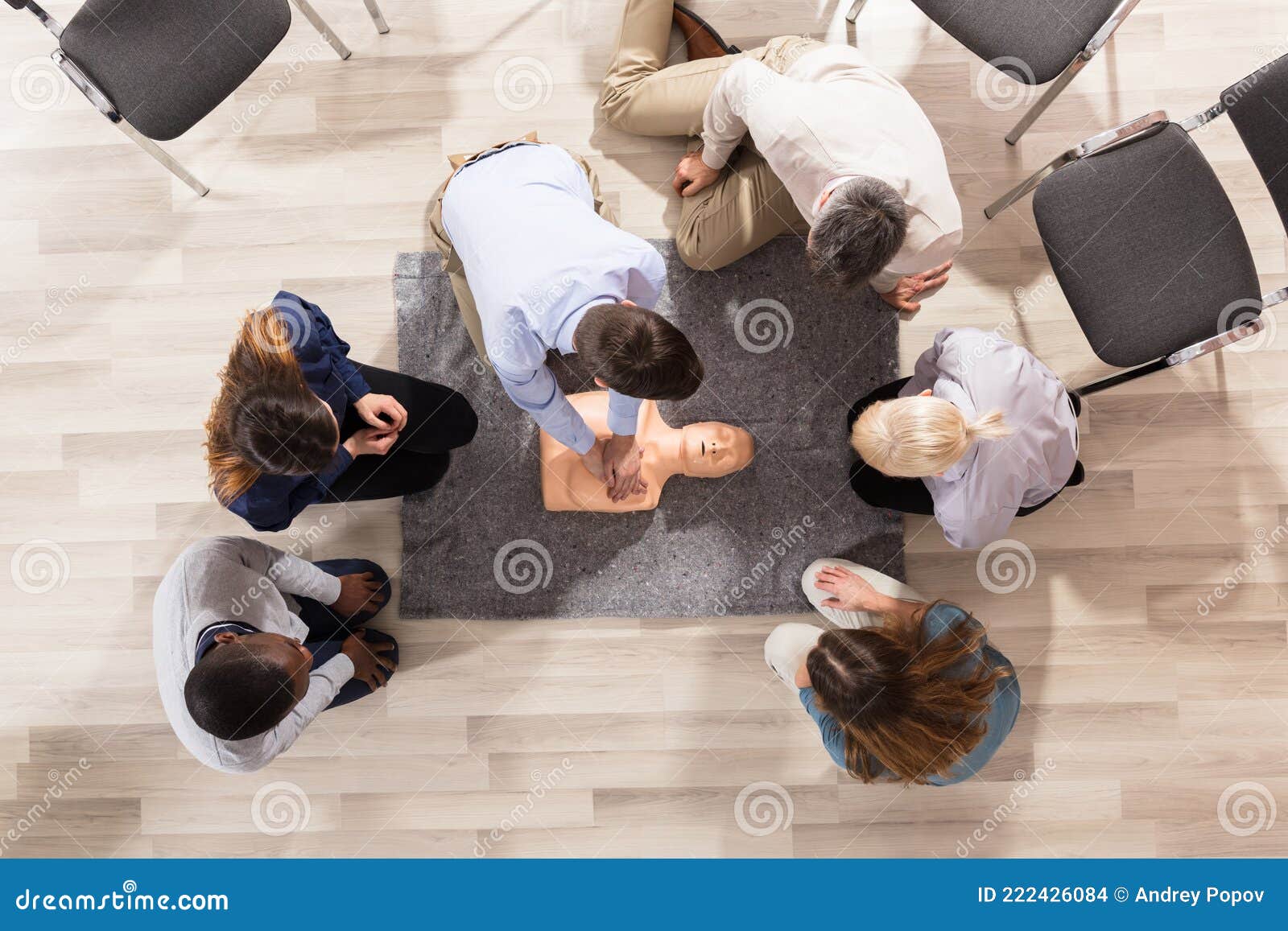 First Aid Instructor Demonstrating CPR Training on Dummy Stock Photo ...