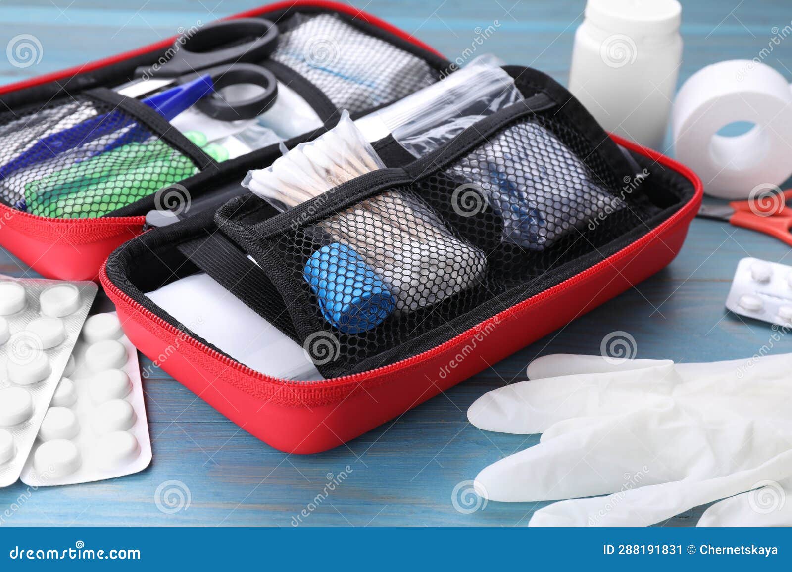 First Aid Kit on Blue Wooden Table, Closeup Stock Image - Image of ...