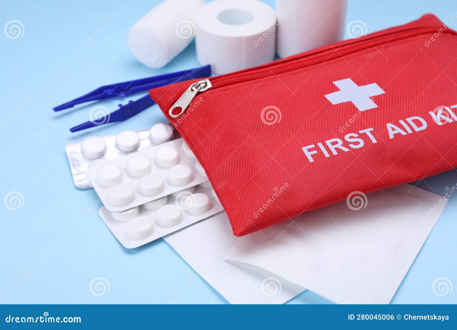 First Aid Kit on Light Blue Background, Closeup Stock Photo - Image of ...