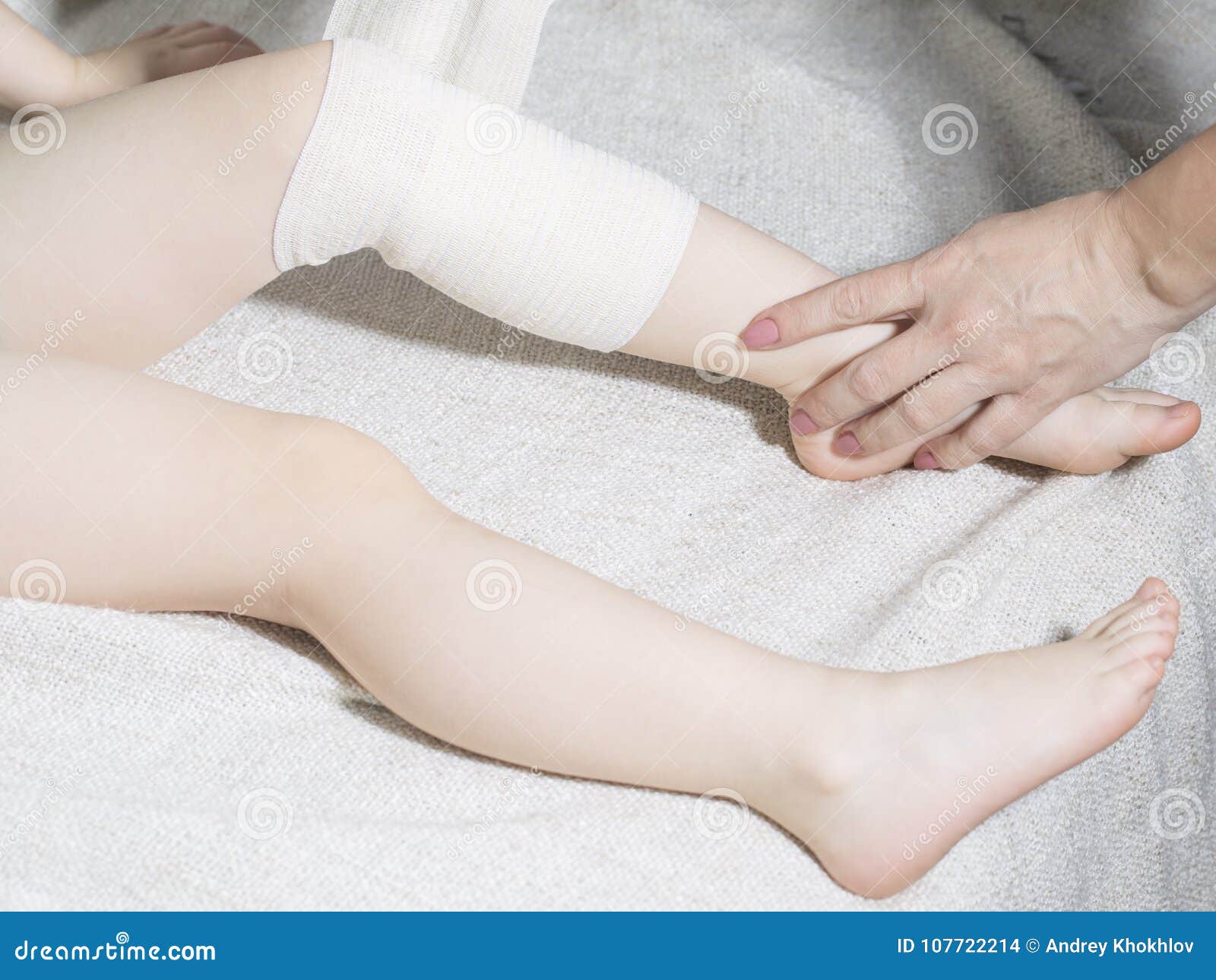 First aid at knee trauma. stock photo. Image of broken - 107722214