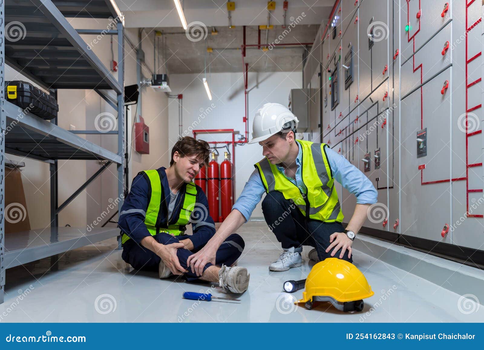 First Aid Support Accident at Work of Worker at Factory. Male Worker ...
