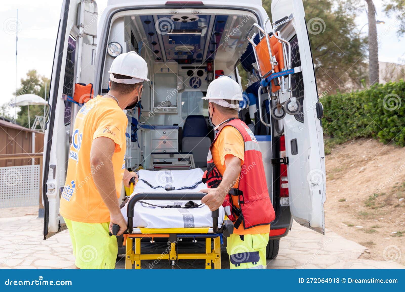 First Aid Team with Uniform Using a Stretcher from an Ambulance Stock ...