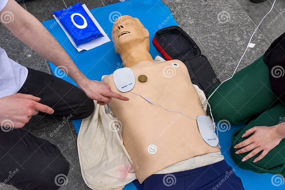First-aider Practicing Chest Compressions Stock Image - Image of ...