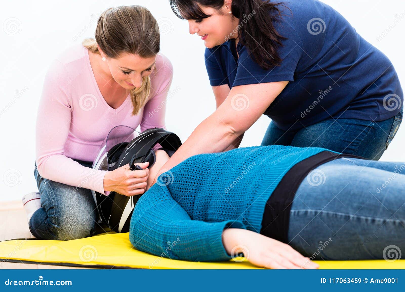 First Aiders Practicing To Remove the Helmet of Injured Biker Stock ...