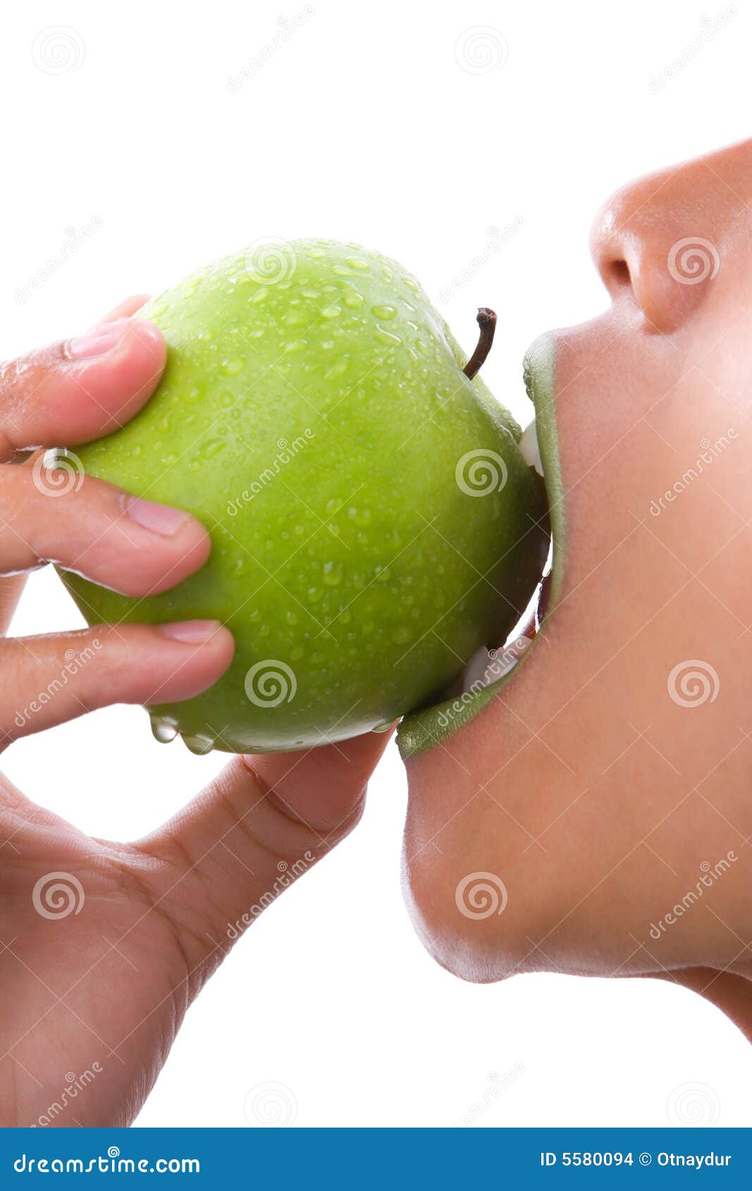 First bite of green apple stock photo. Image of healthy - 5580094