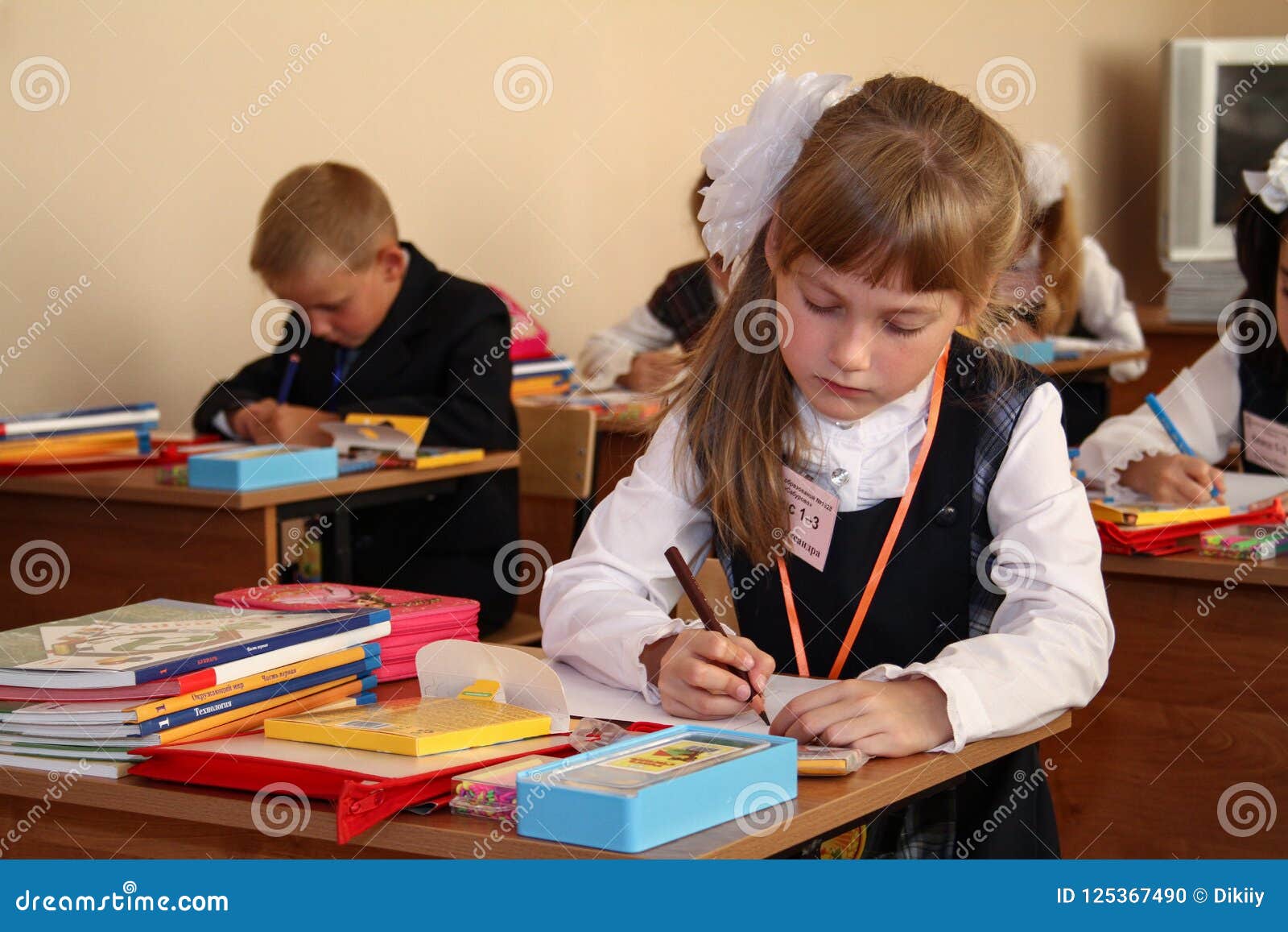 First Class Children Write in Class Editorial Image - Image of sitting ...