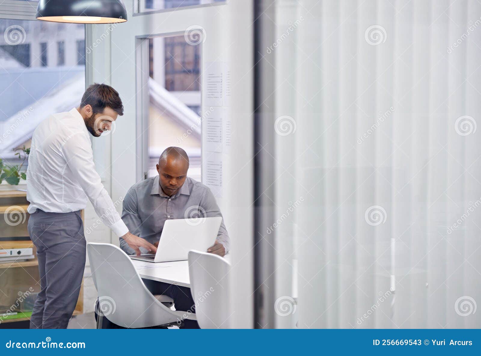 First Day on the Job. a Manager Standing in an Office while Training a ...