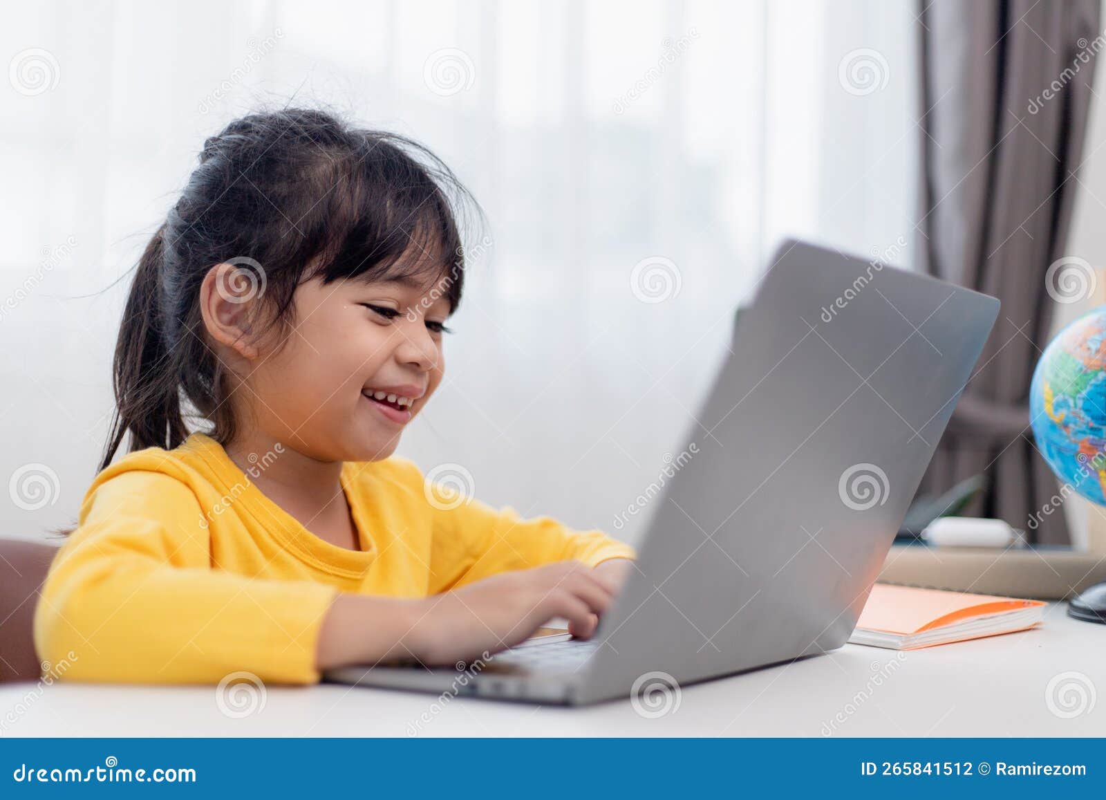 First Day at School. Asian Little Girl Using a Laptop Computer ...