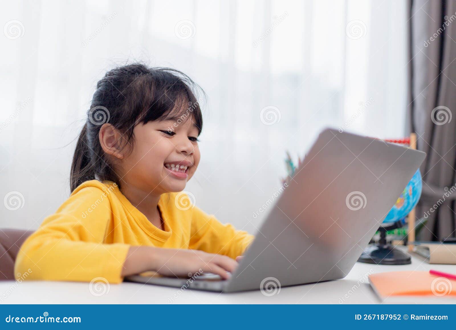 First Day at School. Asian Little Girl Using a Laptop Computer ...
