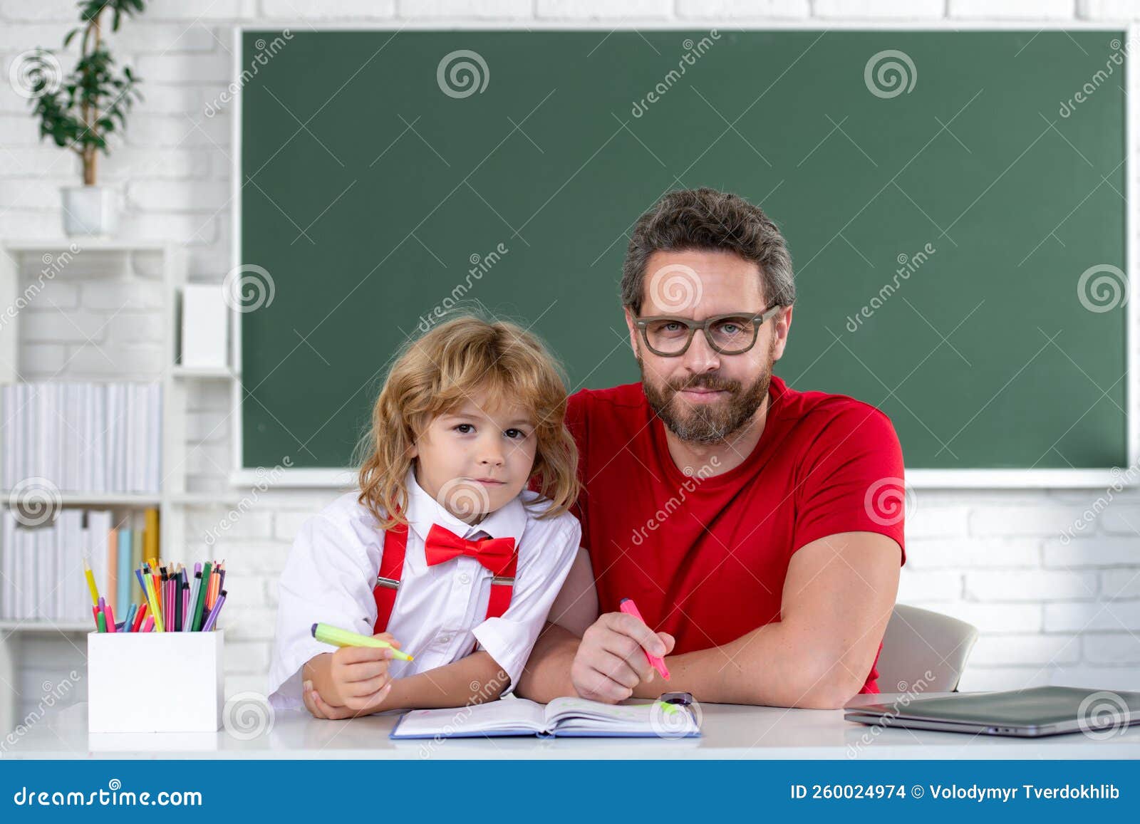 First Day at School. Cute Little Boy Studying Lesson in Class. Cute ...