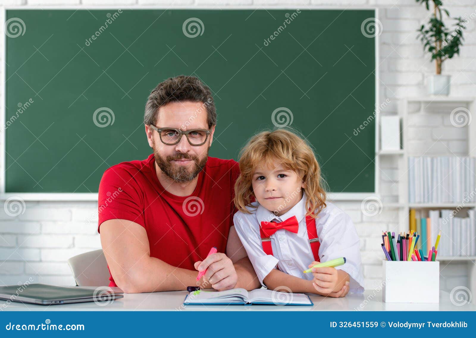 First Day at School. Cute Little Boy Studying Lesson in Class. Cute ...