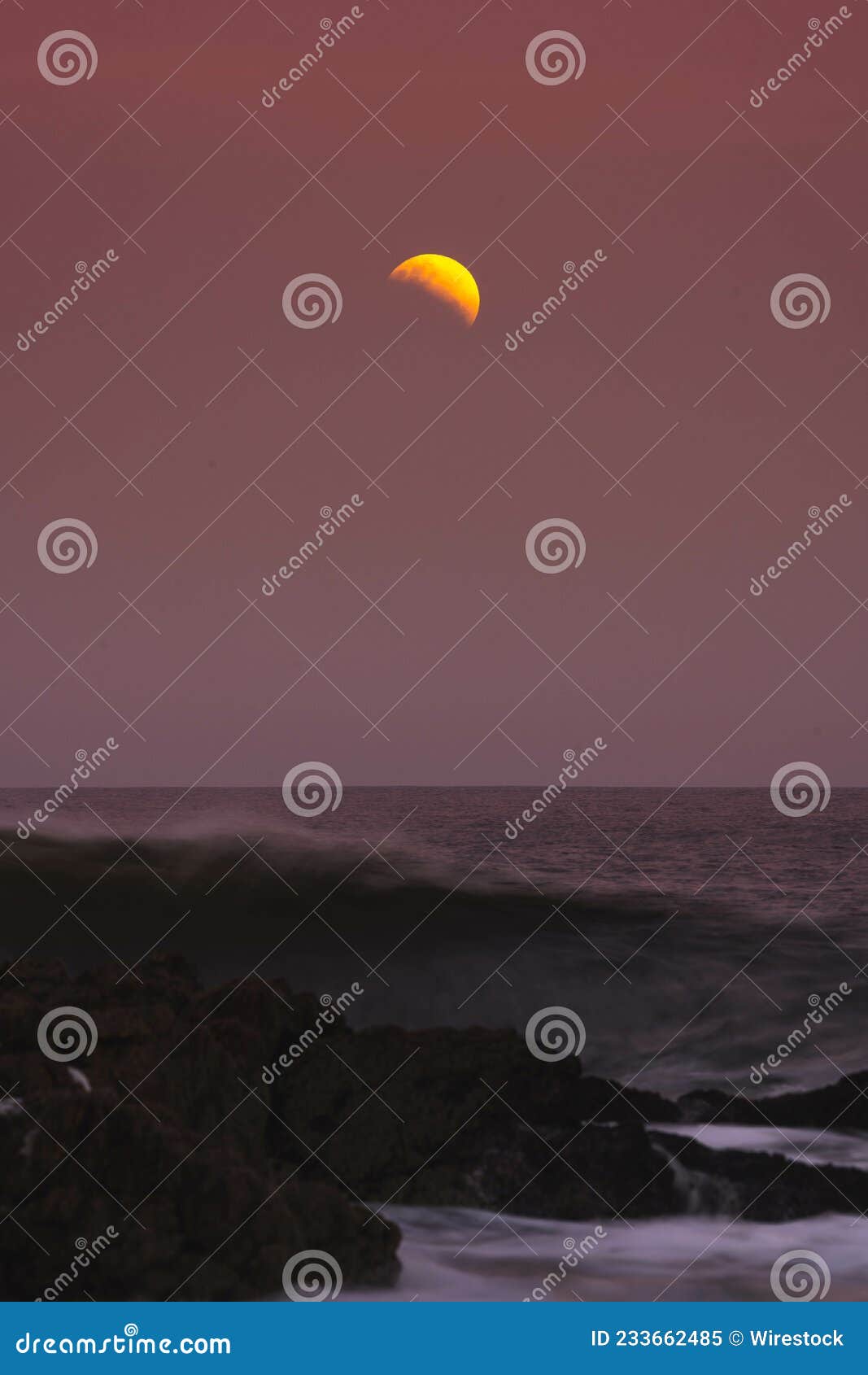 First Glare of the Moon Over the Splashing Sea Water at Sunset Stock ...