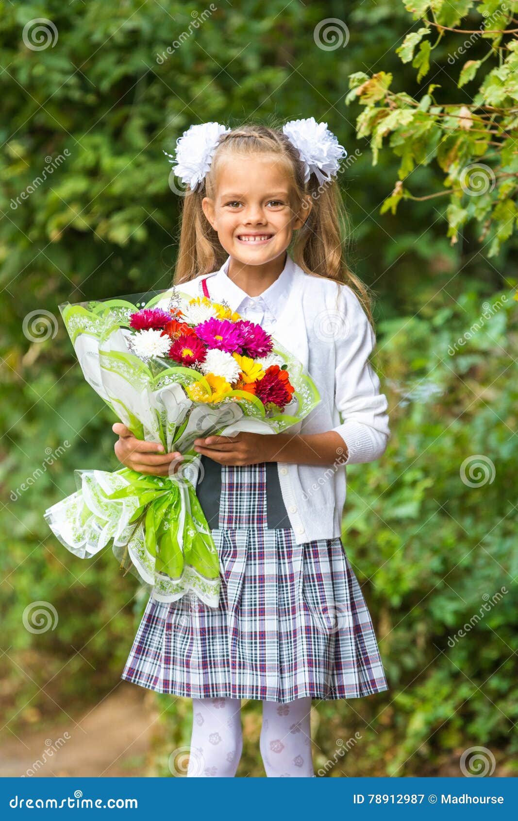 First Grader with Bouquet of Flowers Smiling Happily Stock Image ...