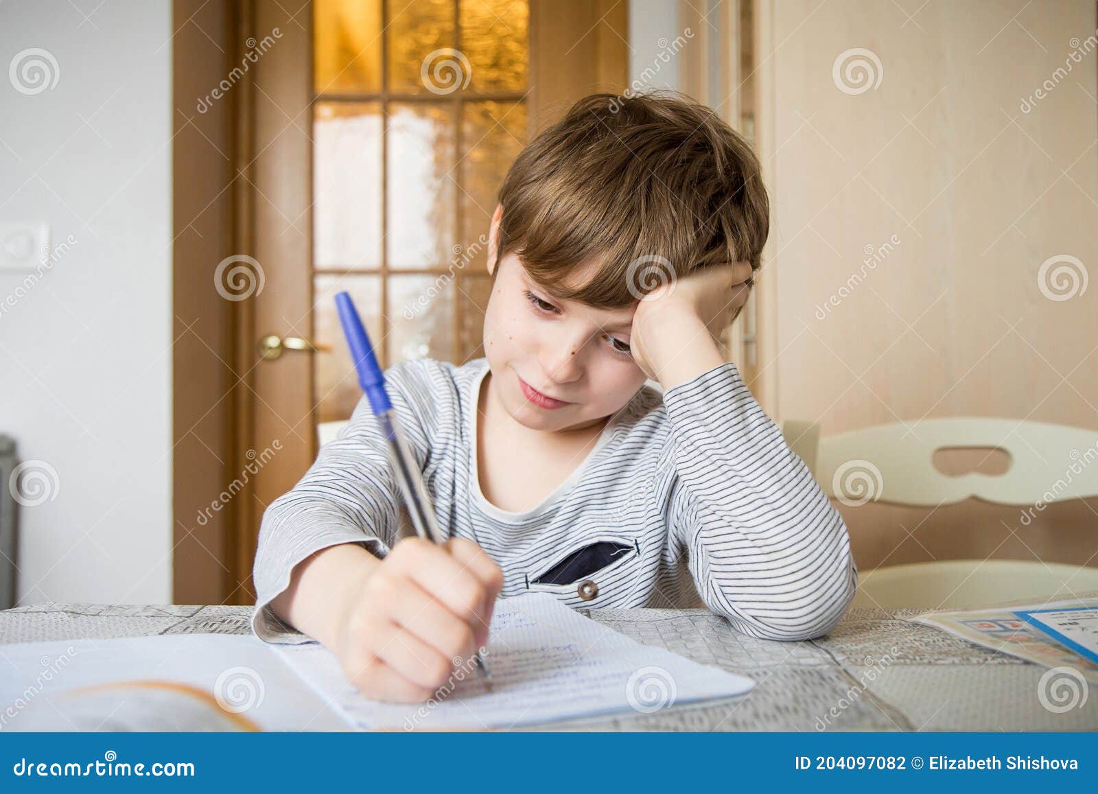 A First-grader Boy Does His Homework in Isolation Stock Photo - Image ...