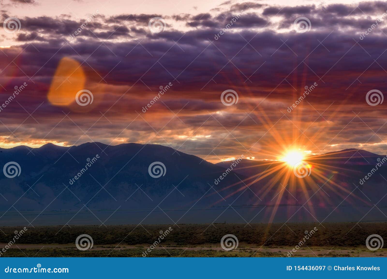 First Light of Day As a Large Sunburst Peaks Over the Edge of a ...