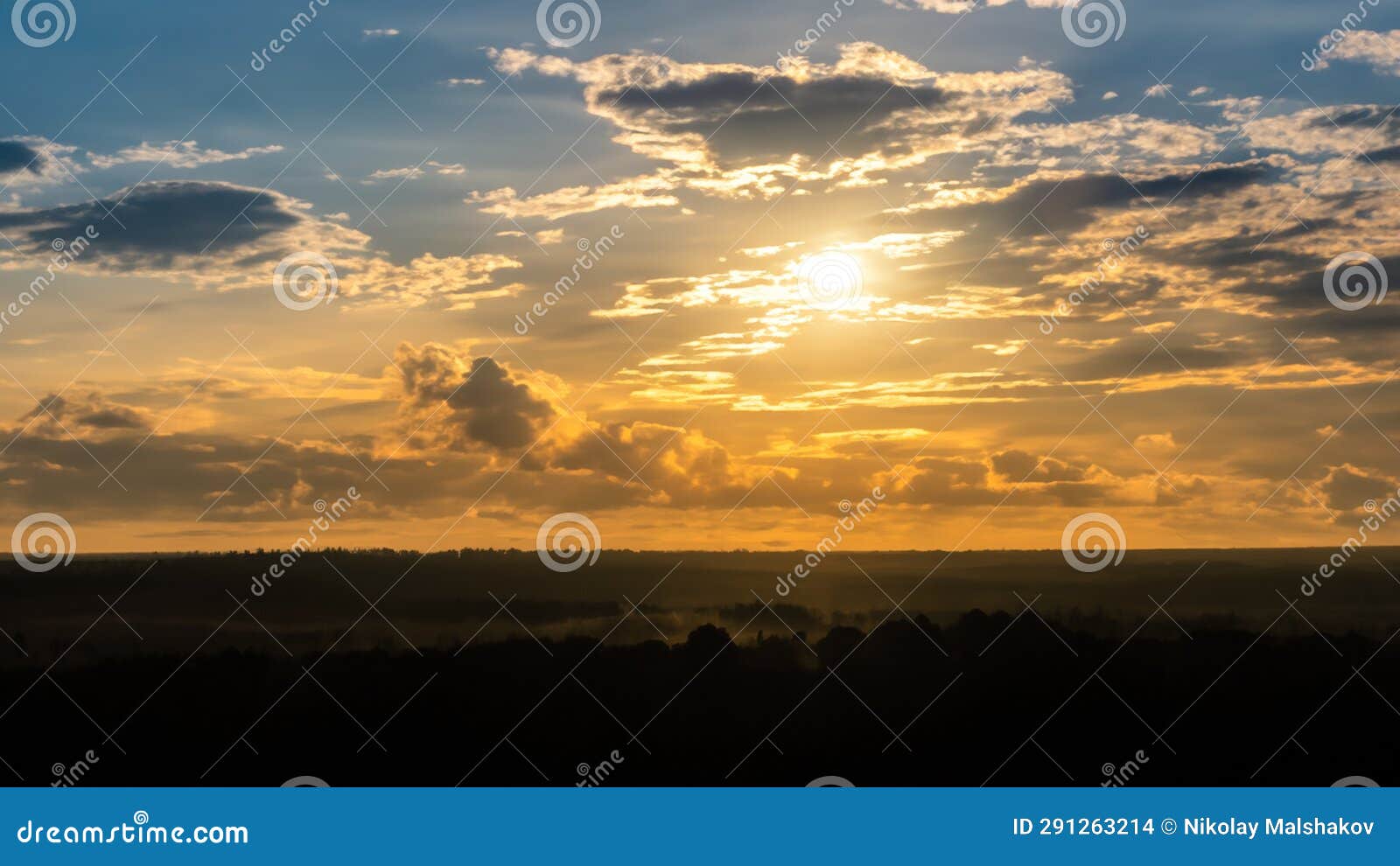 First Light: Sun on the Horizon with Beautiful Clouds Stock ...