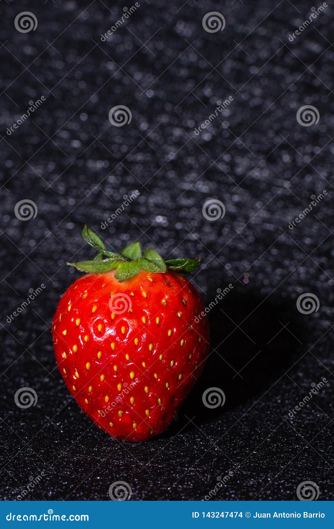 STRAWBERRY PROJECTING ITS SHADOW ISOLATED in BACKGROUND with BLACK ...