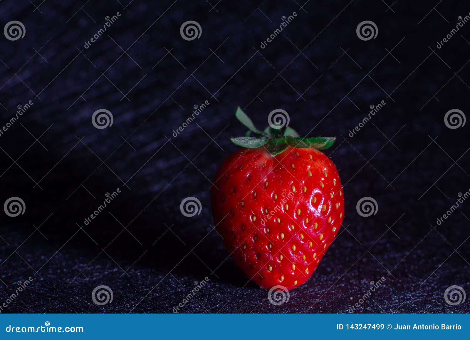 STRAWBERRY PROJECTING ITS SHADOW ISOLATED in BACKGROUND with BLACK ...