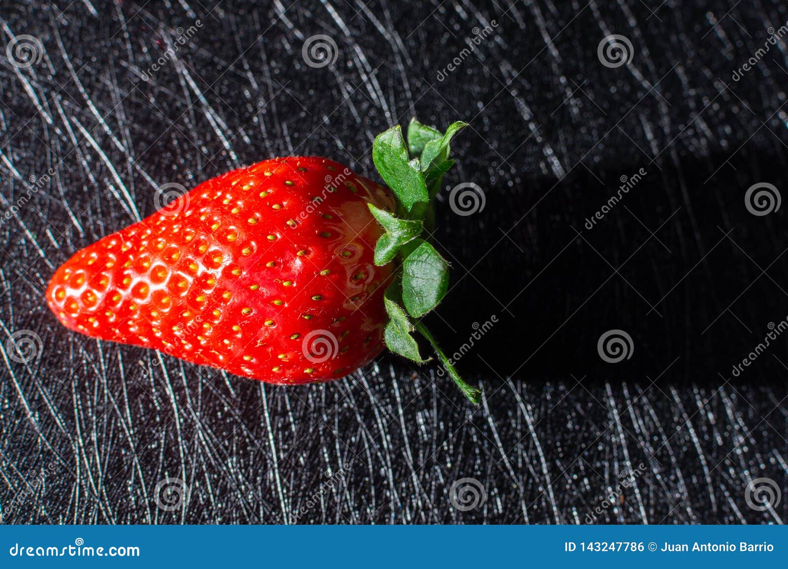 STRAWBERRY PROJECTING ITS SHADOW ISOLATED in BACKGROUND with BLACK ...
