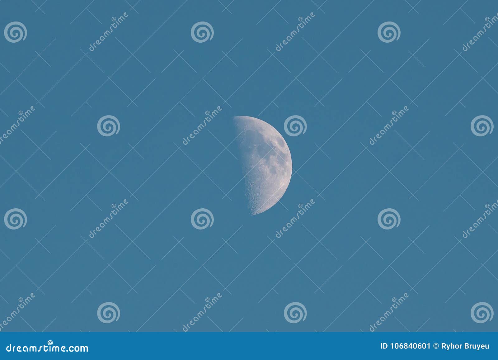 First Quarter of Moon in Blue Sky Background Stock Image - Image of ...