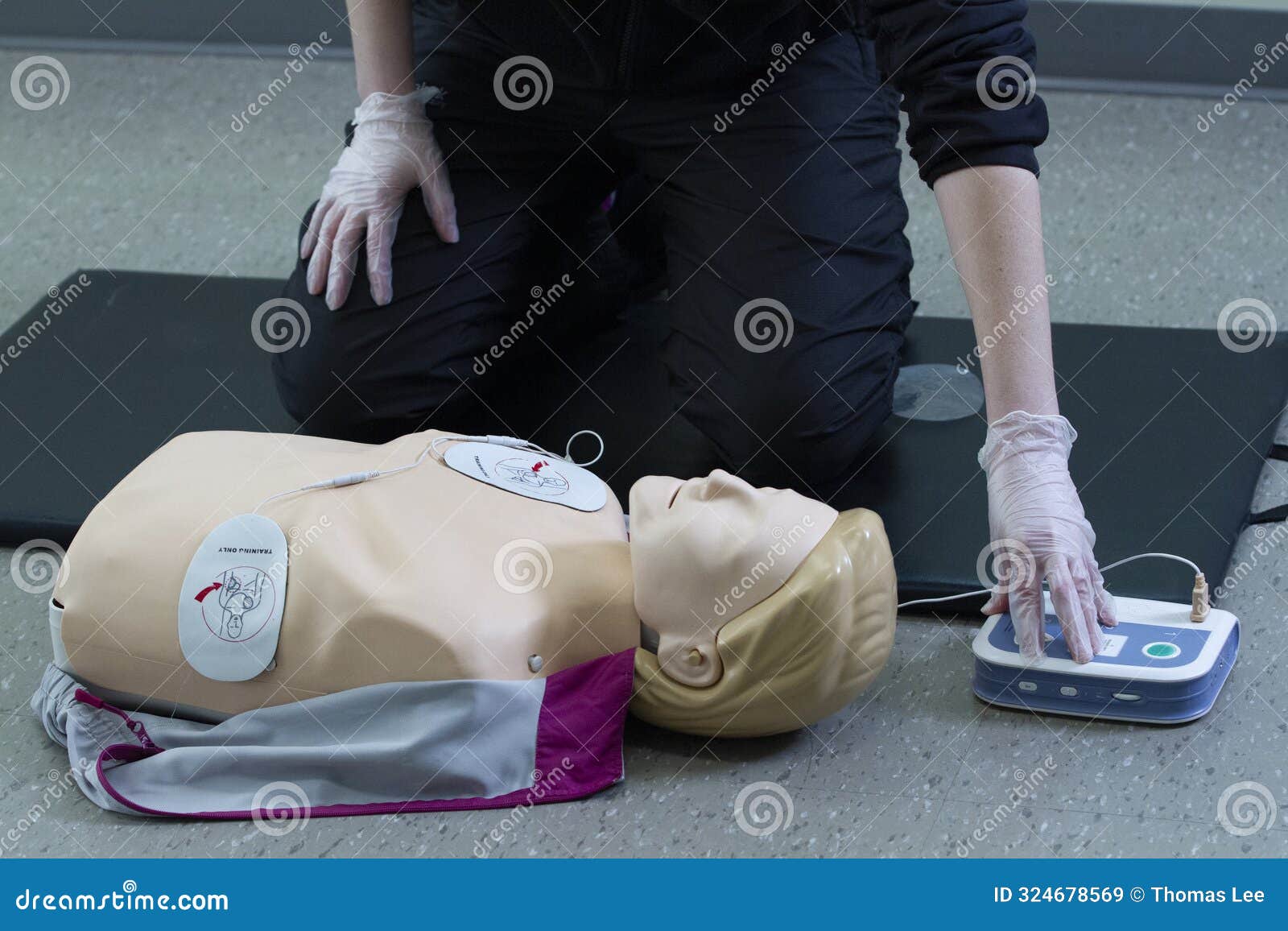 First Responce Worker Demonstrades CPR and Proper Defibrillator ...