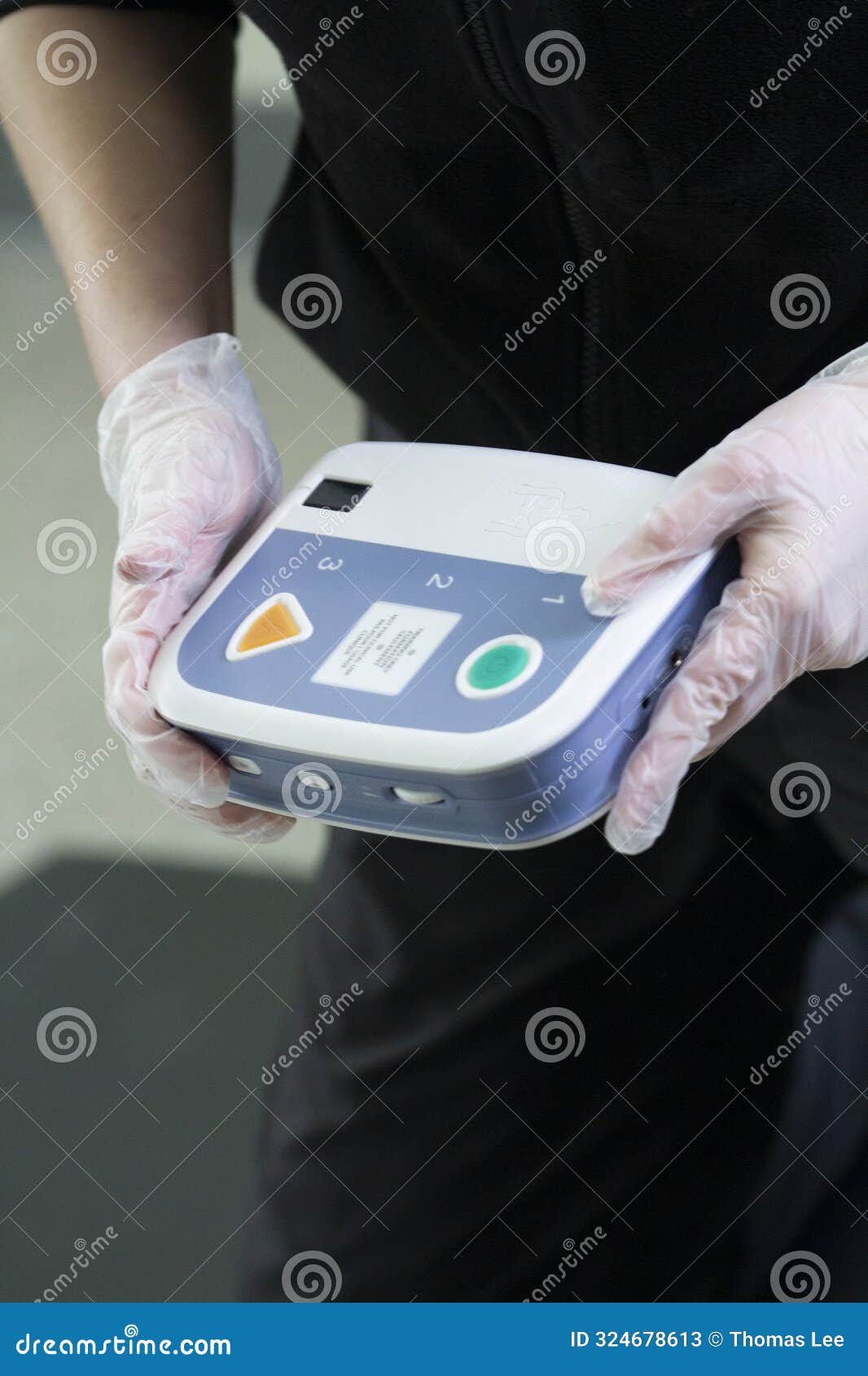 First Response Worker Demonstrates CPR and Proper Defibrillator ...