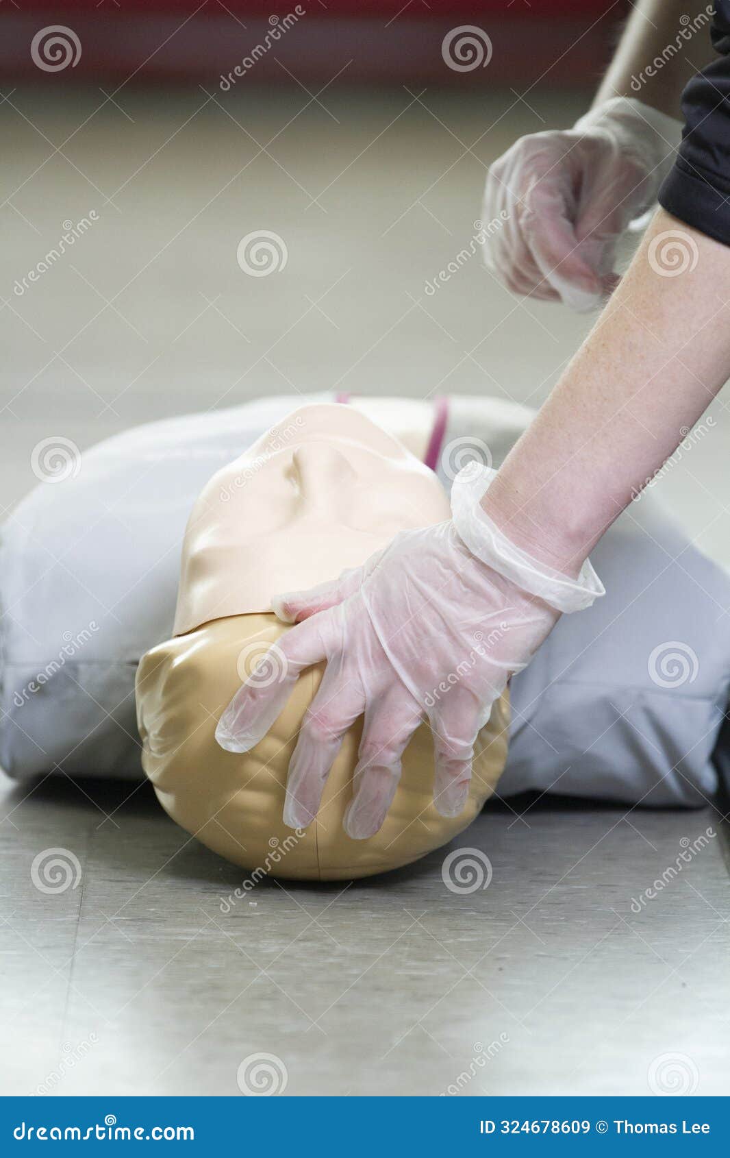 First Response Worker Demonstrates CPR and Proper Defibrillator ...
