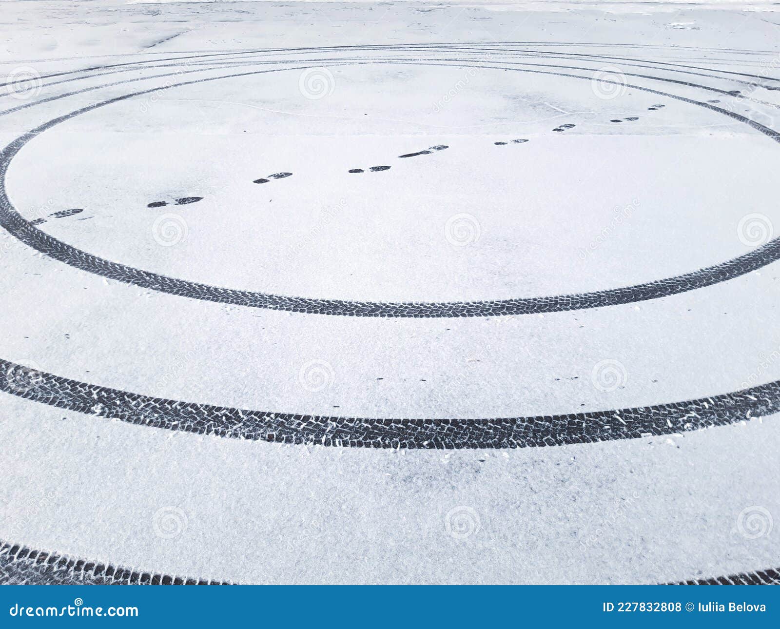 First Snow. an Imprint of the Wheels of a Car in a Circle and a Man ...