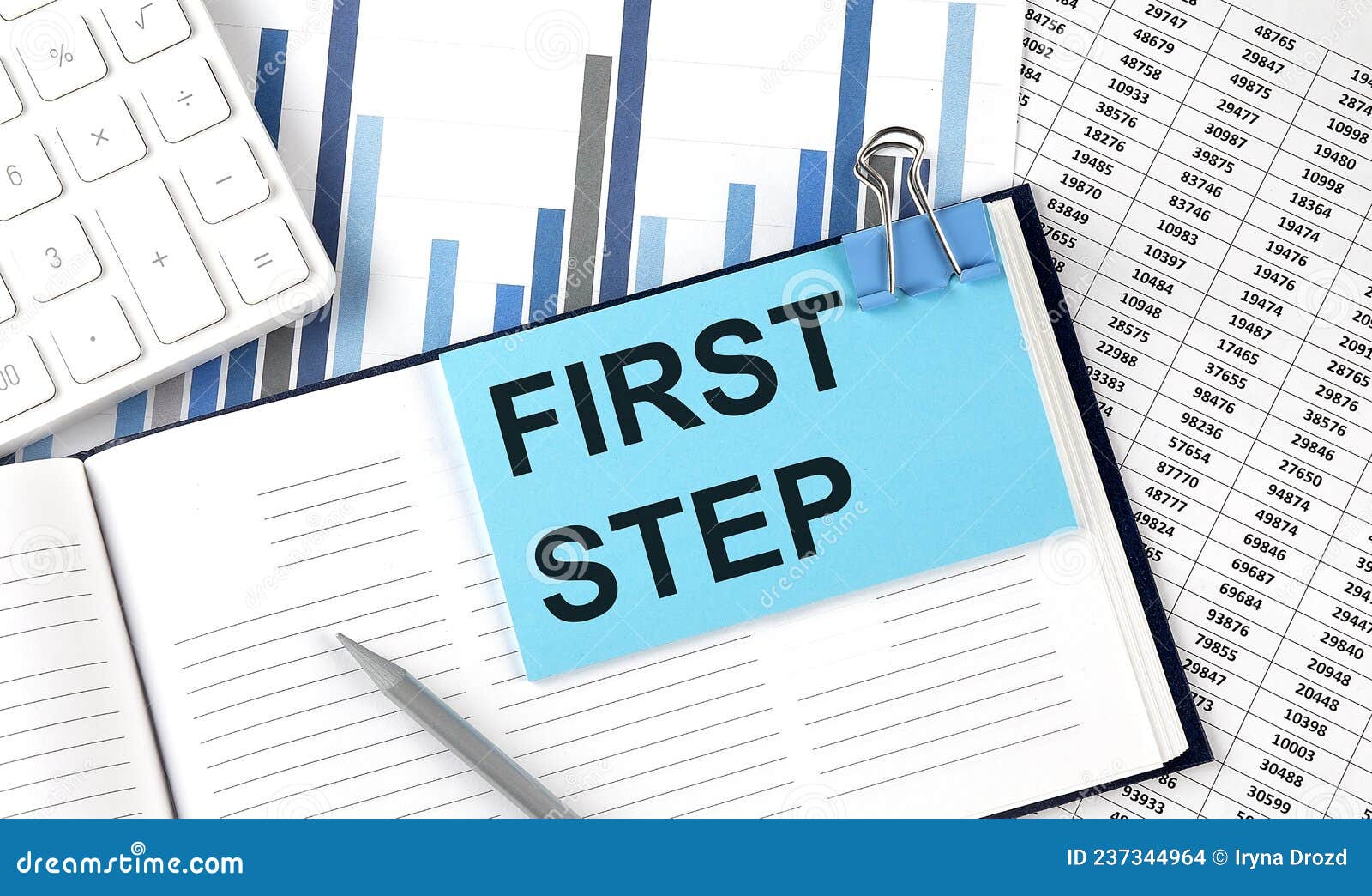FIRST STEP Text on Blue Sticker on the Chart Background Near Calculator ...