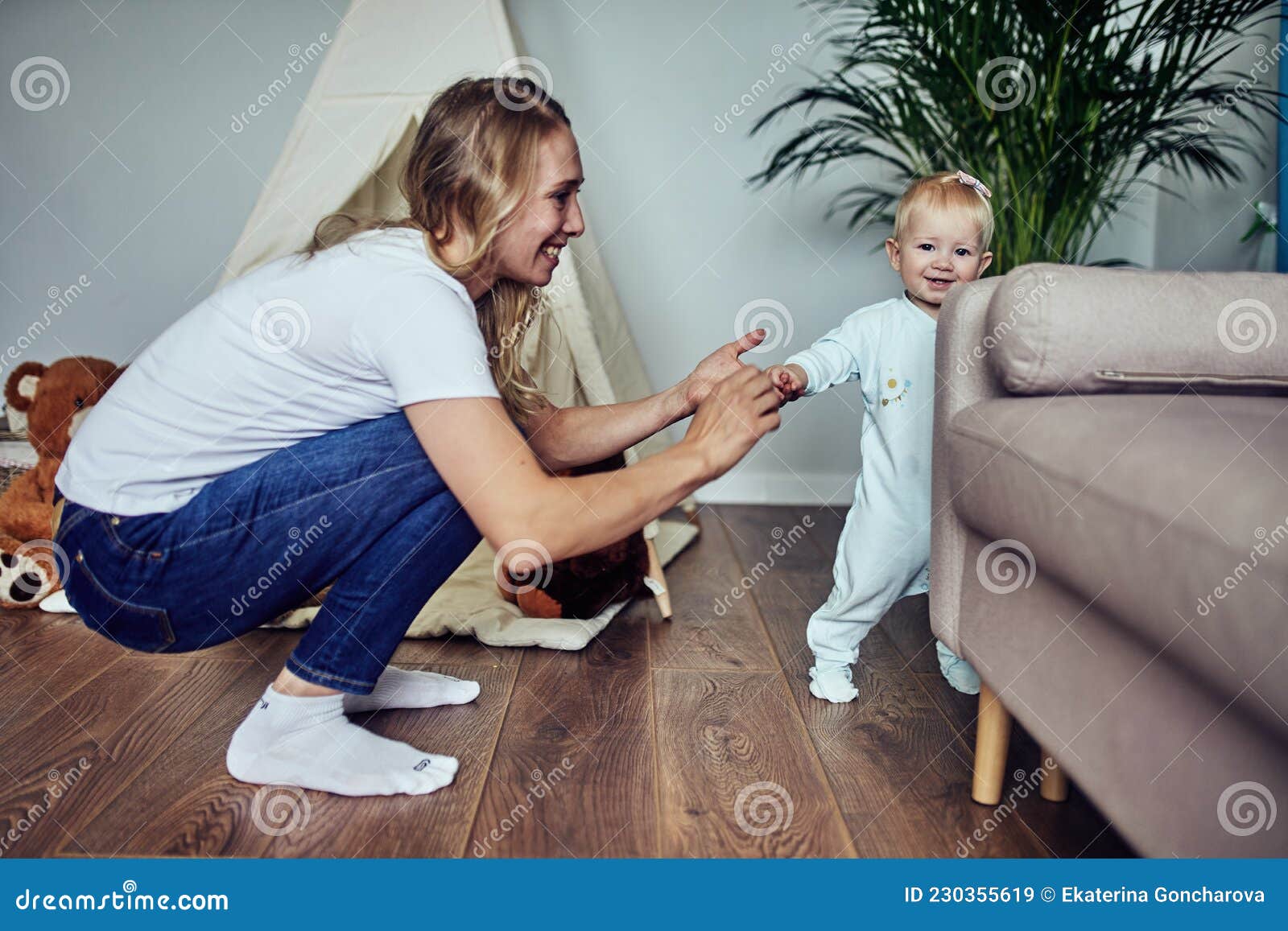 The First Steps of the Child at the Sofa. Stock Image - Image of girl ...