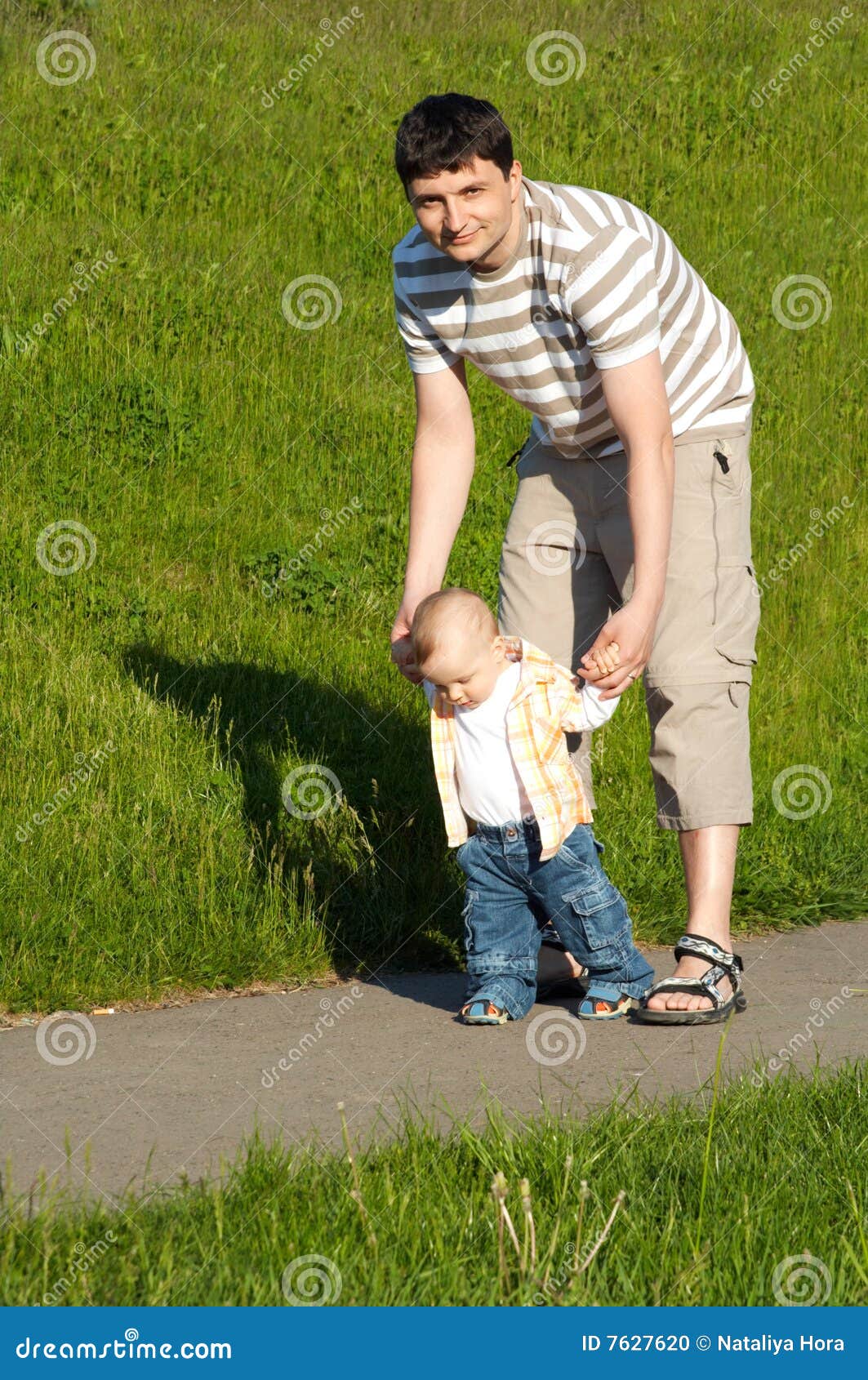 First steps with father stock photo. Image of loving, summer - 7627620