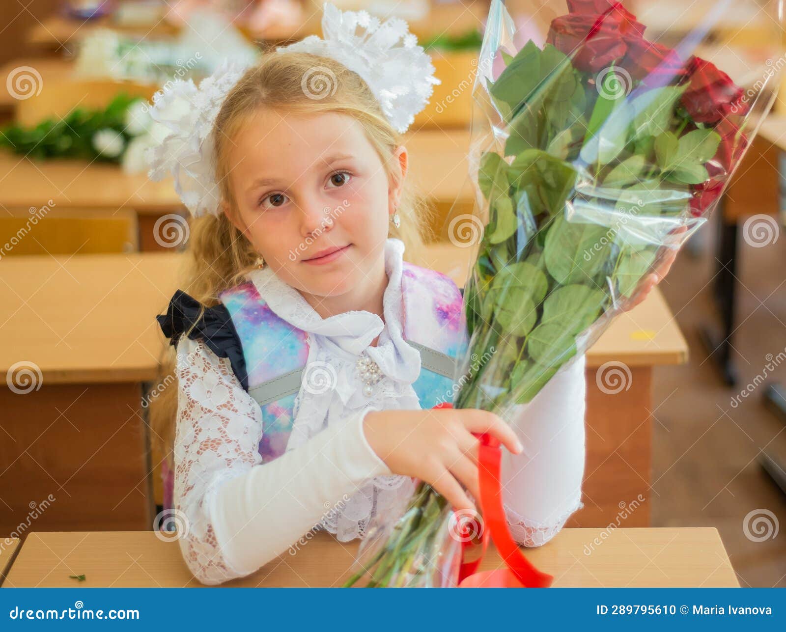 A First-grader Girl in a Beautiful Elegant Modern School Uniform on the ...