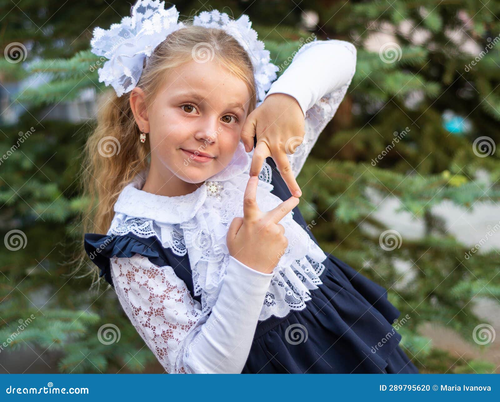 A First-grader Girl in a Beautiful Elegant Modern School Uniform on the ...