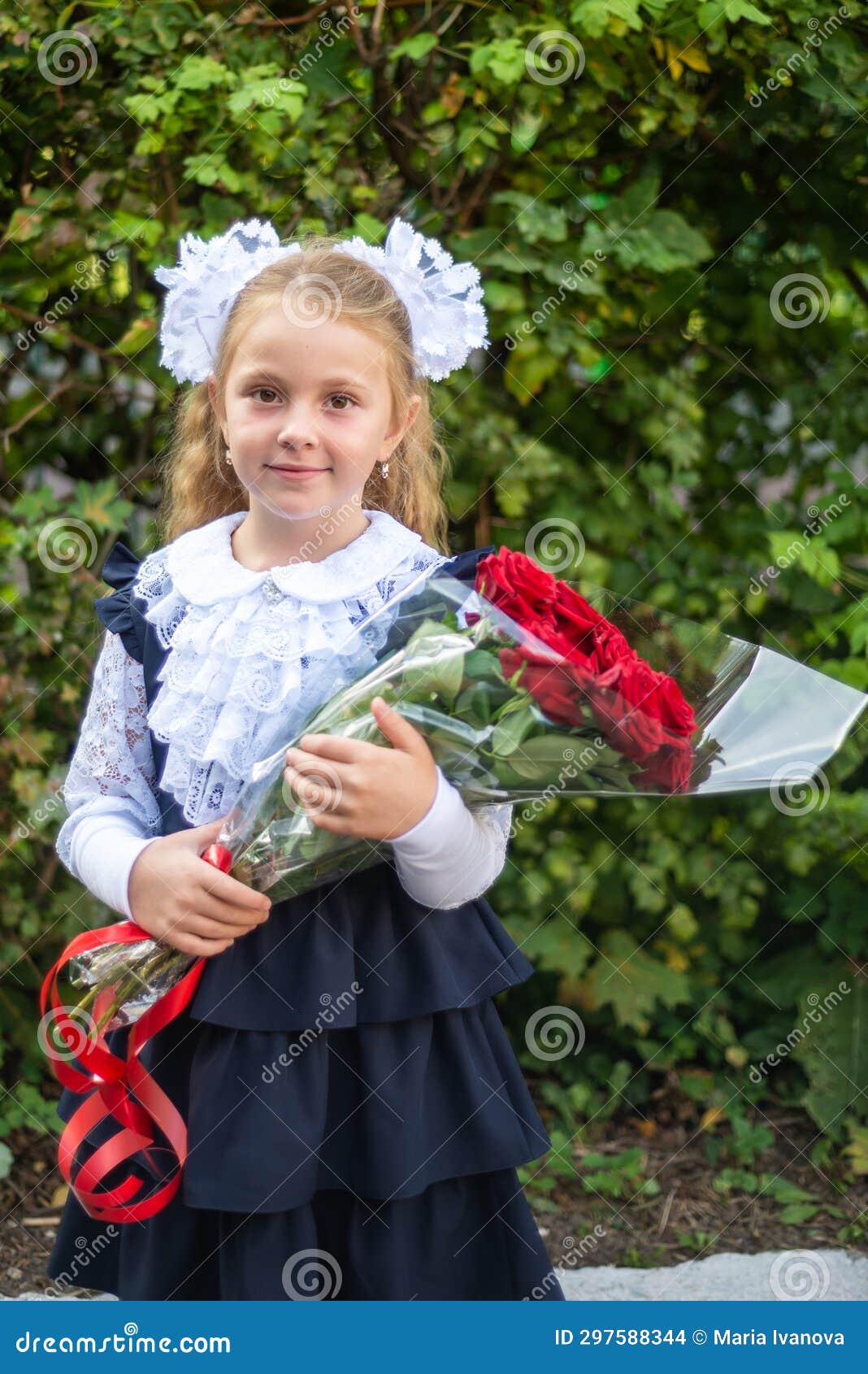 A First-grader Girl in a Beautiful Elegant Modern School Uniform on the ...
