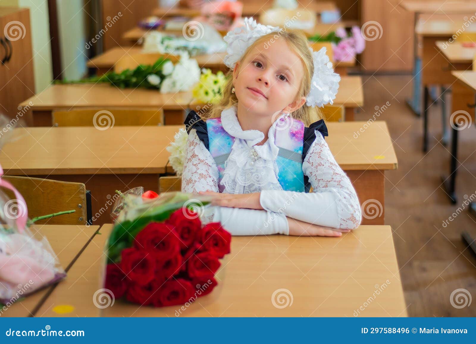 A First-grader Girl in a Beautiful Elegant Modern School Uniform on the ...