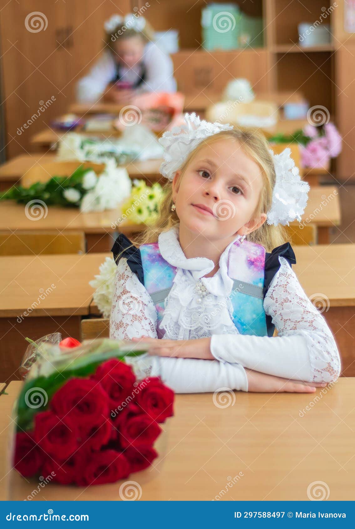A First-grader Girl in a Beautiful Elegant Modern School Uniform on the ...