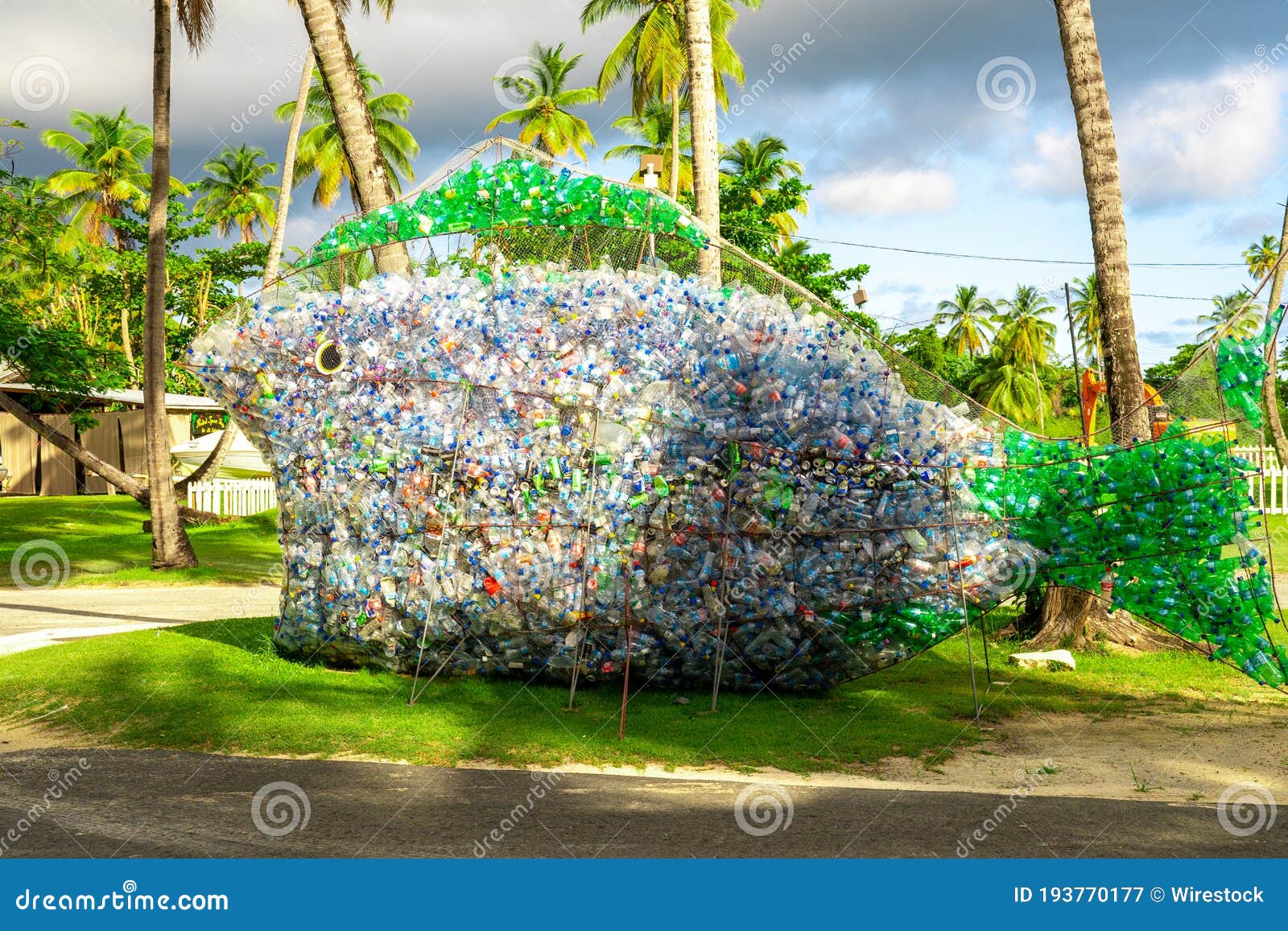Fish Artwork Made by Plastic Bottles Under the Palm Trees in the Beach ...
