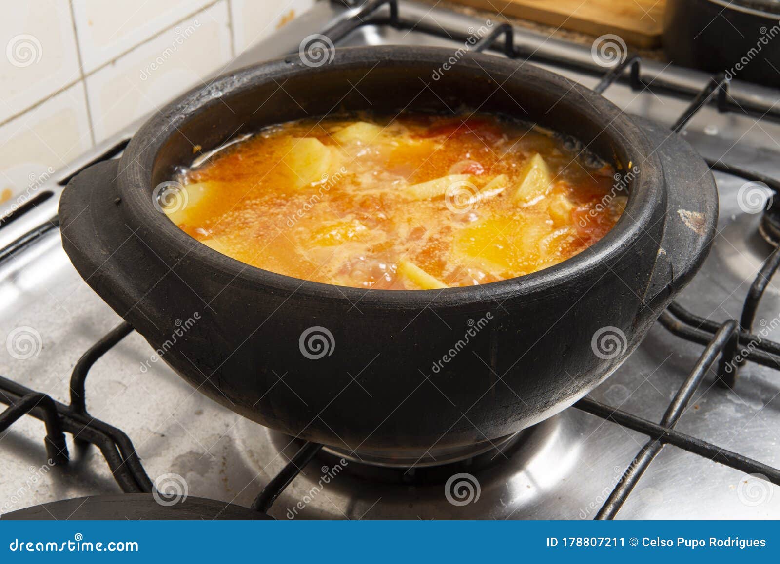 Fish Being Cooked in a Clay Pot Stock Image - Image of green, plate ...