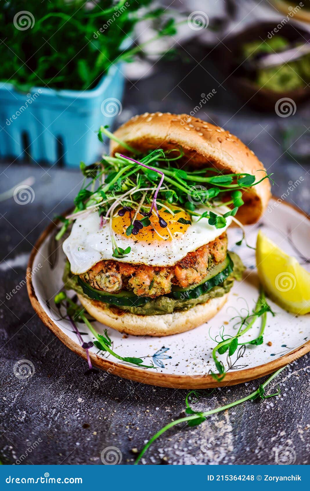 Fish Burger with Avocado Sauce Stock Photo - Image of sandwich, cooked ...