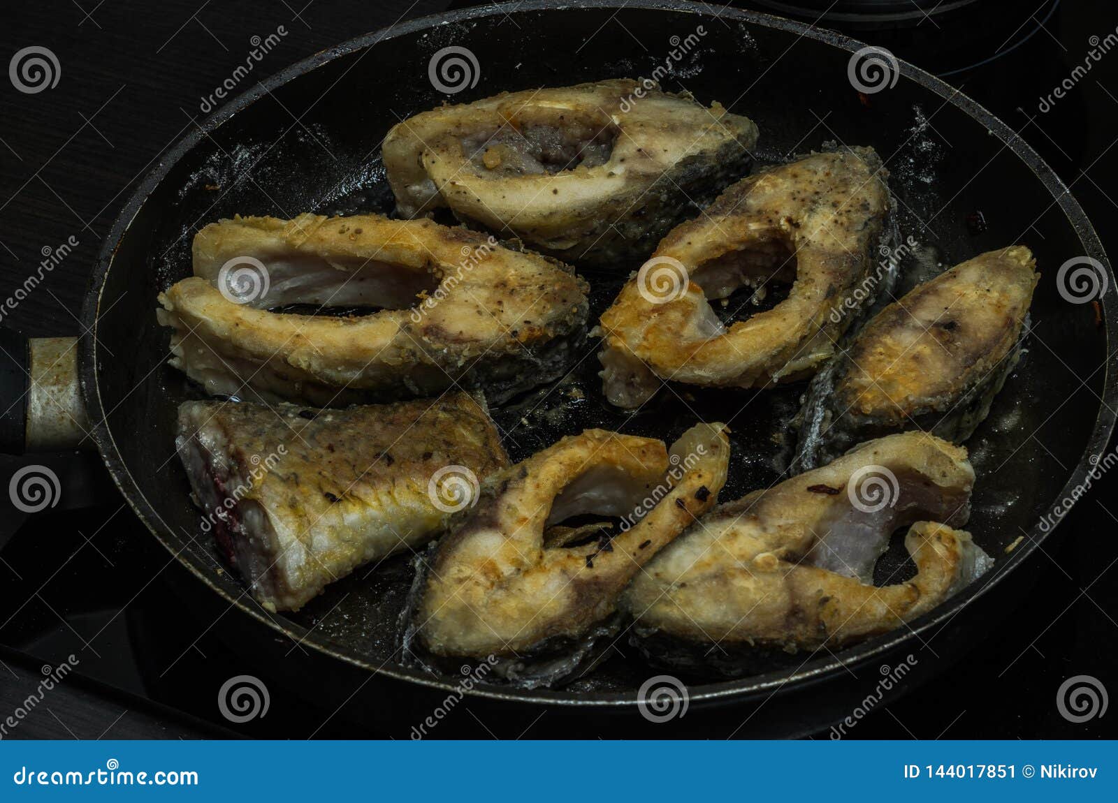 Fish carp fried in a pan stock image. Image of dish - 144017851