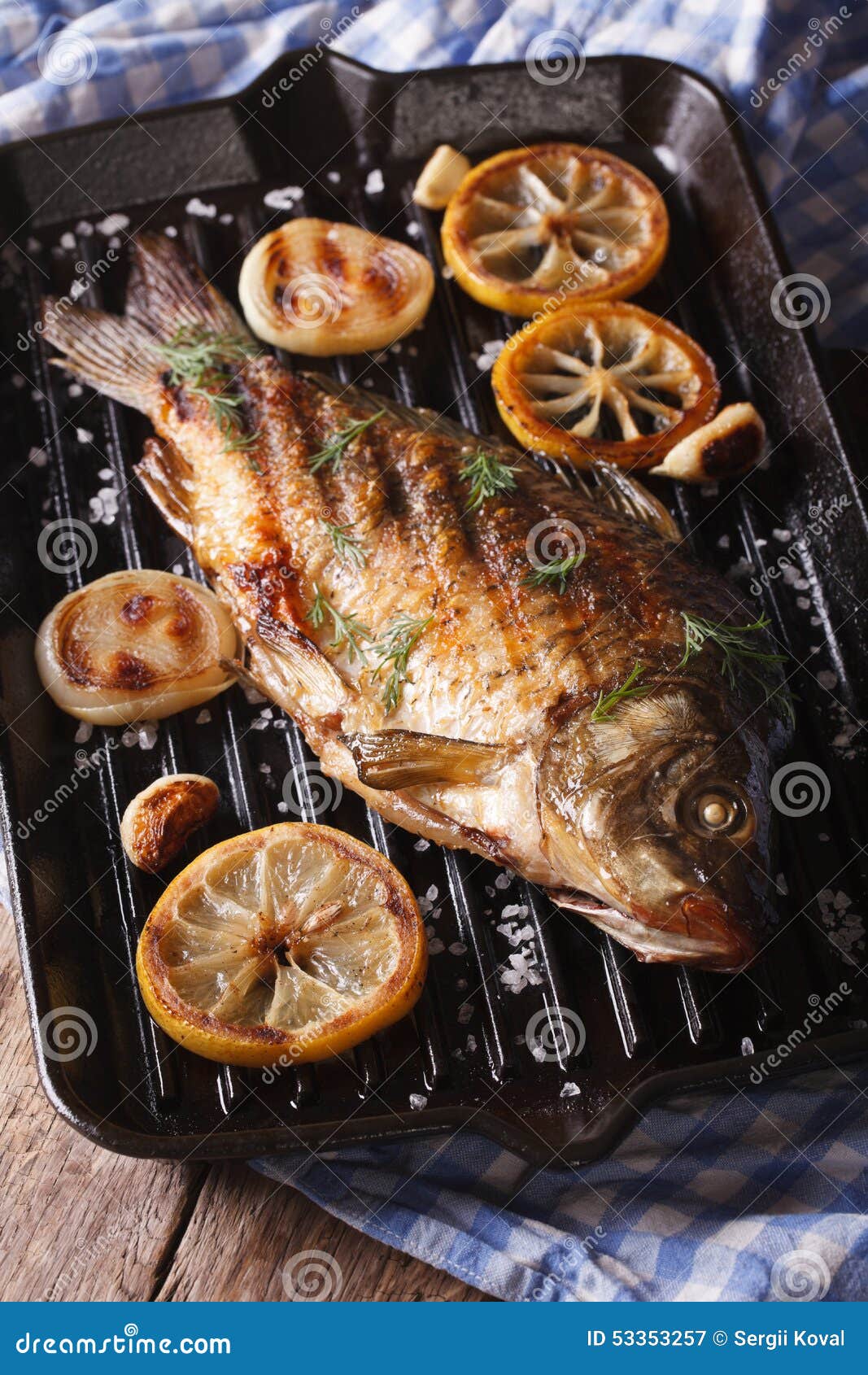 Fish Carp with Lemon and Onion on Grill Pan, Vertical Stock Image ...