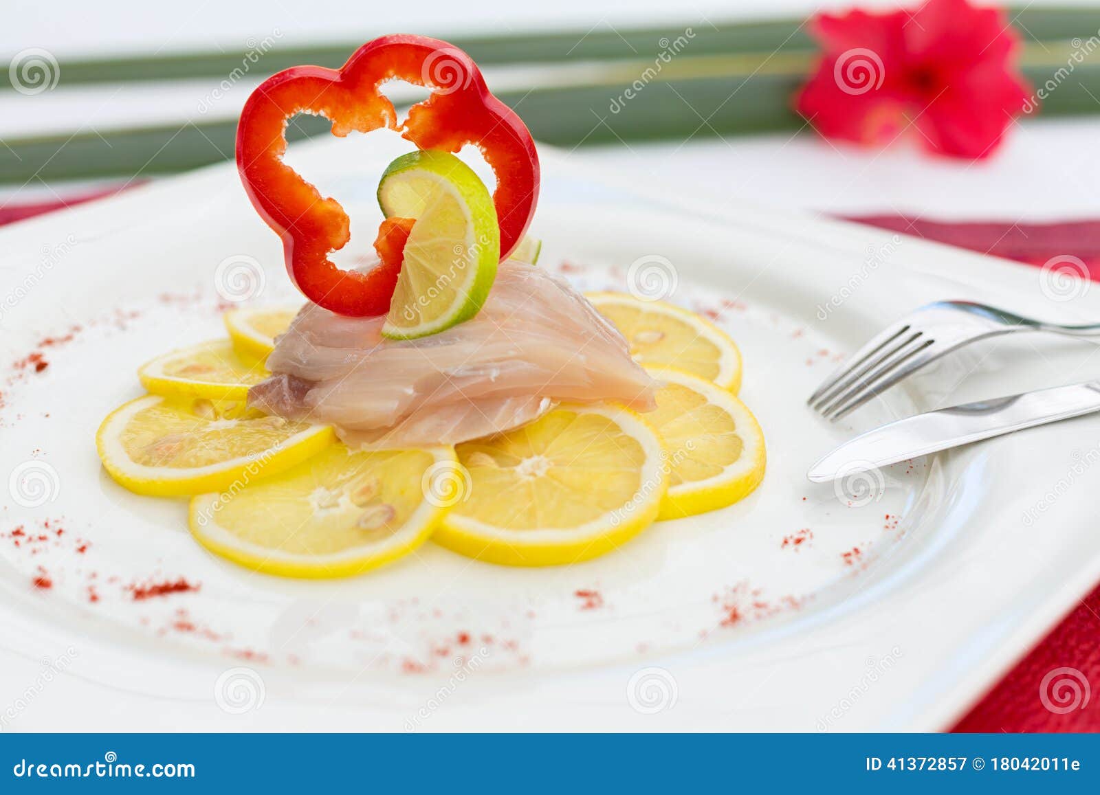 Fish Carpaccio on Lemon, Decorated with Red Bell Stock Image - Image of ...